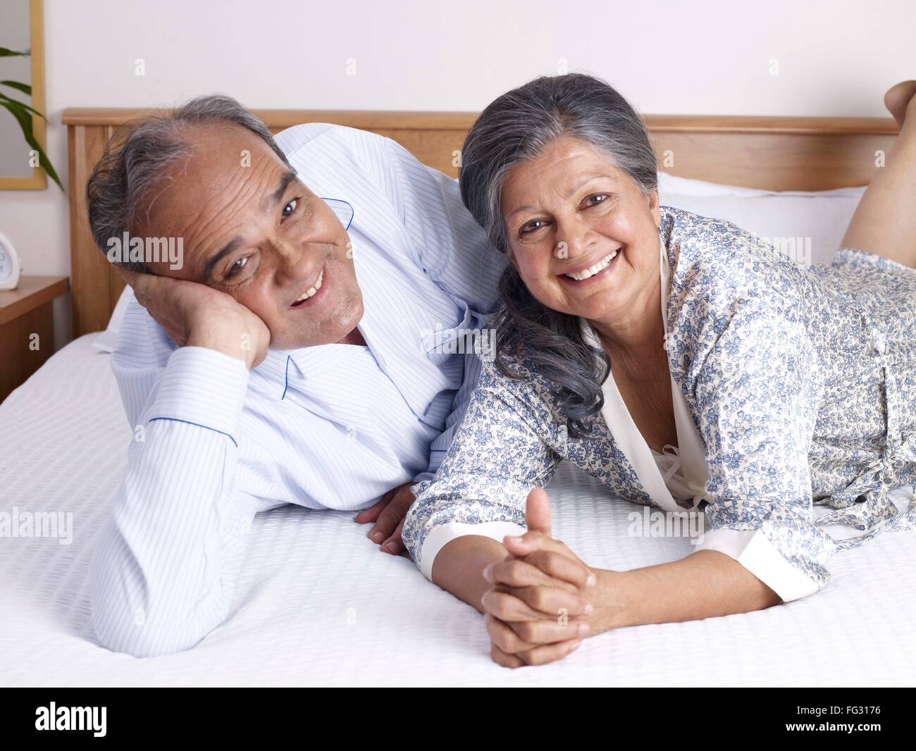 Old couple resting in bedroom MR#702T,702S Stock Photo - Alamy