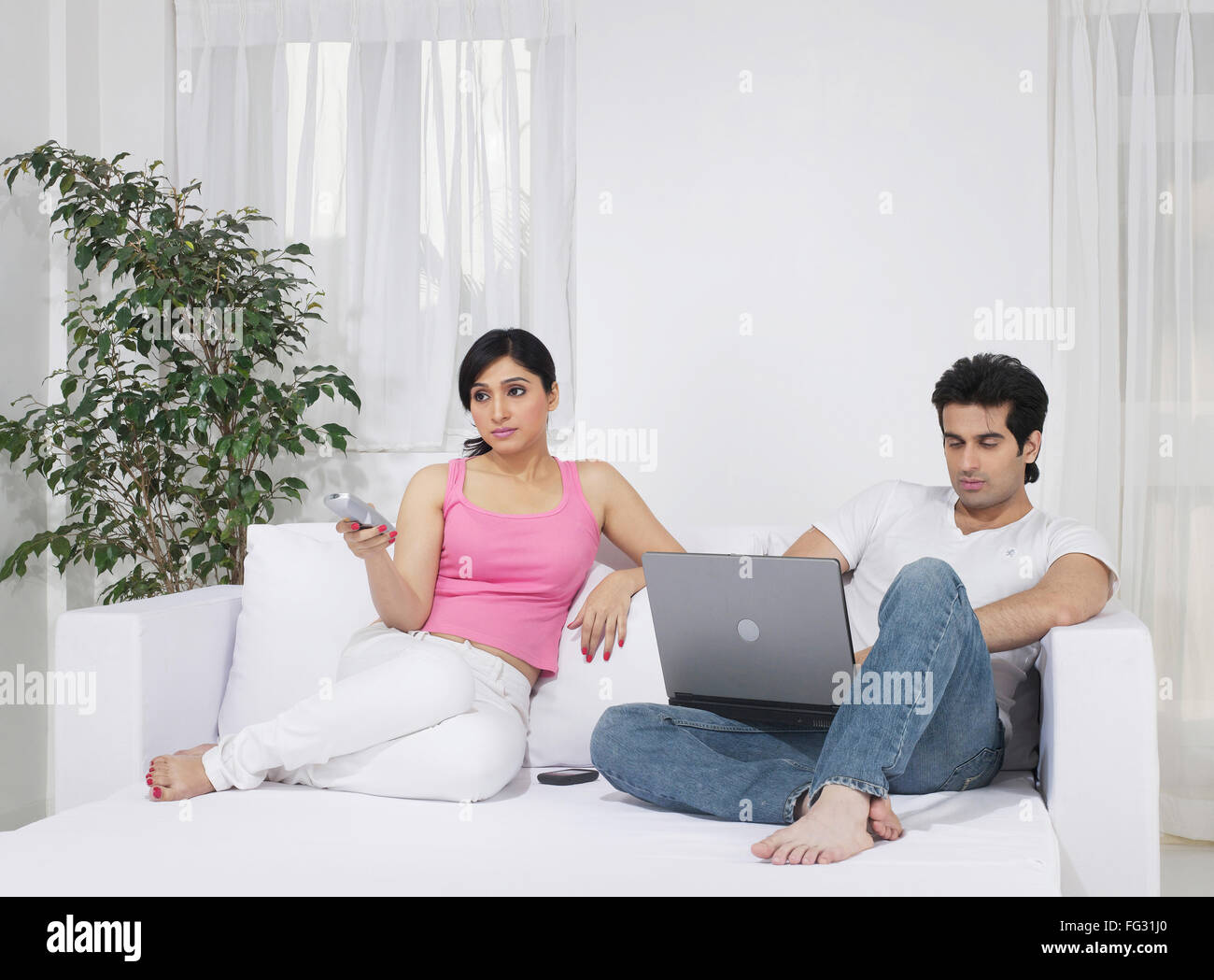 Indian couples remote control hi-res stock photography and images - Alamy