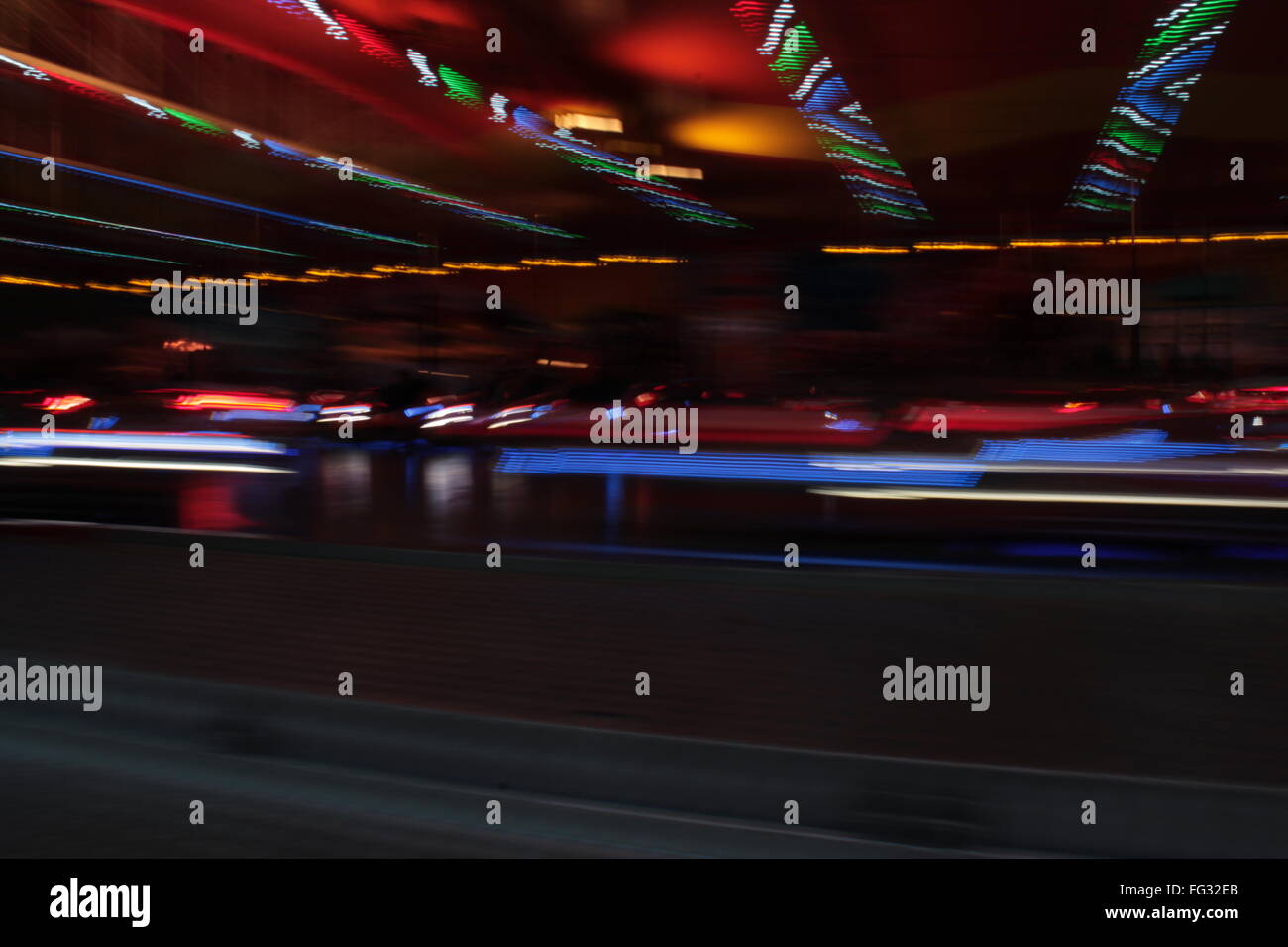 fairground funfair ride moving fast fair lights Night colours of the ...