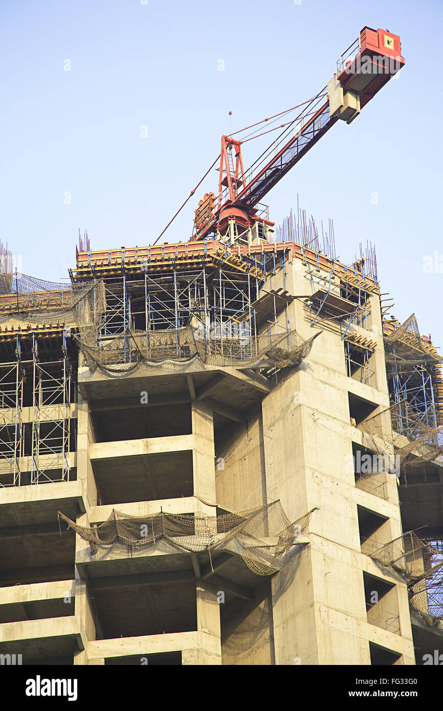 Construction of building with crane Stock Photo - Alamy