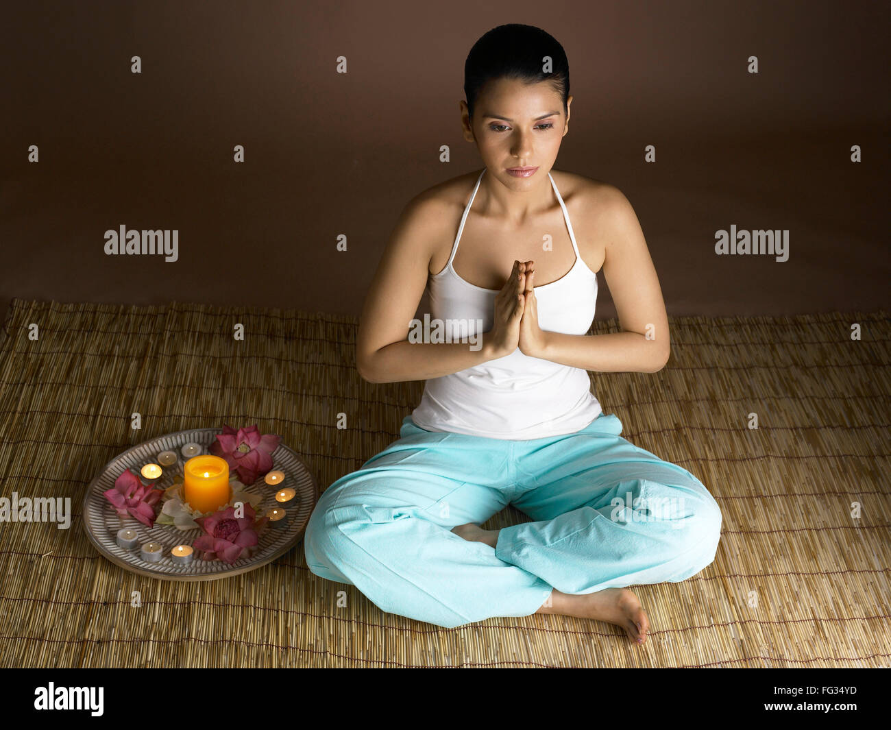 South Asian Indian woman praying with prayer utensil MR # 702 Stock ...