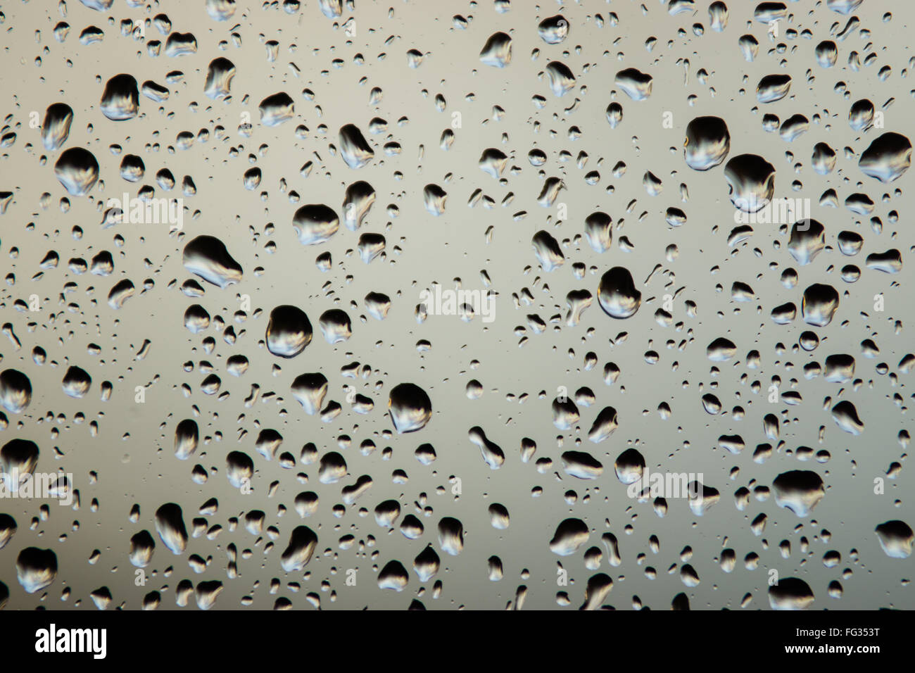 Background of water drops on a windowpane. metallic rain drops Stock Photo - Alamy