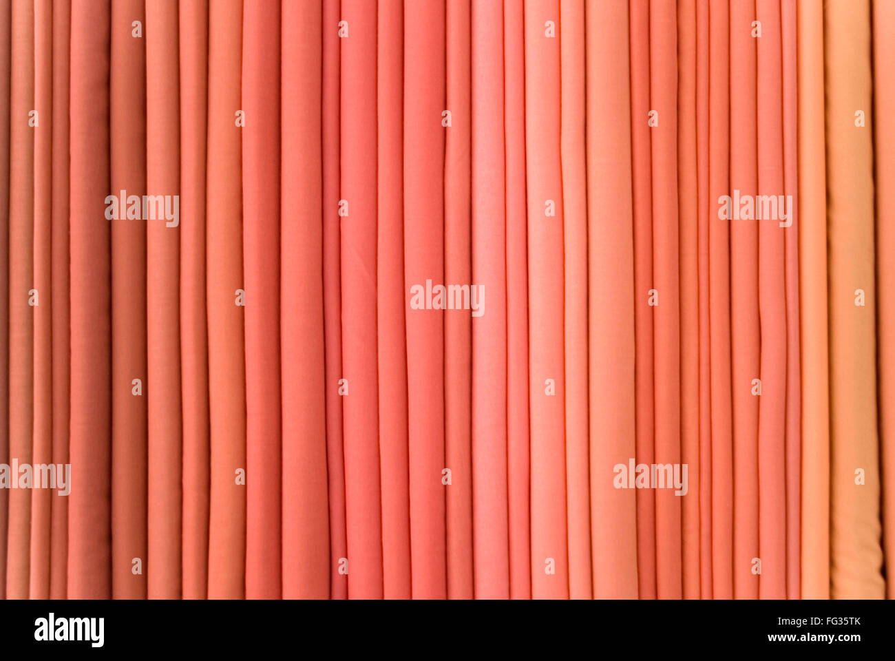 Colourful plain cloth arrange in row in matching centre Stock Photo - Alamy