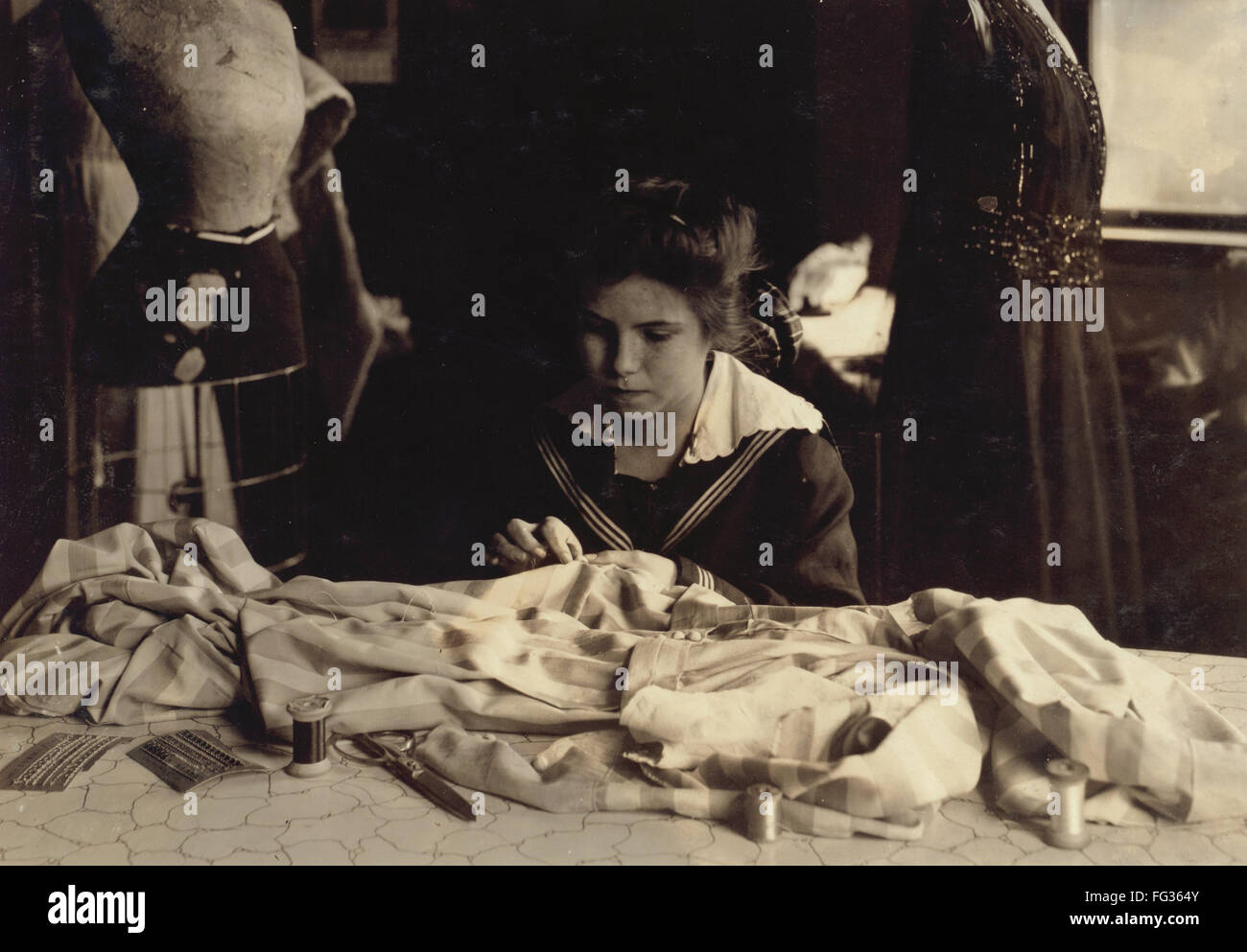 HINE: SEAMSTRESS, 1917. /n16-year-old Helen Anderson sewing gowns for ...