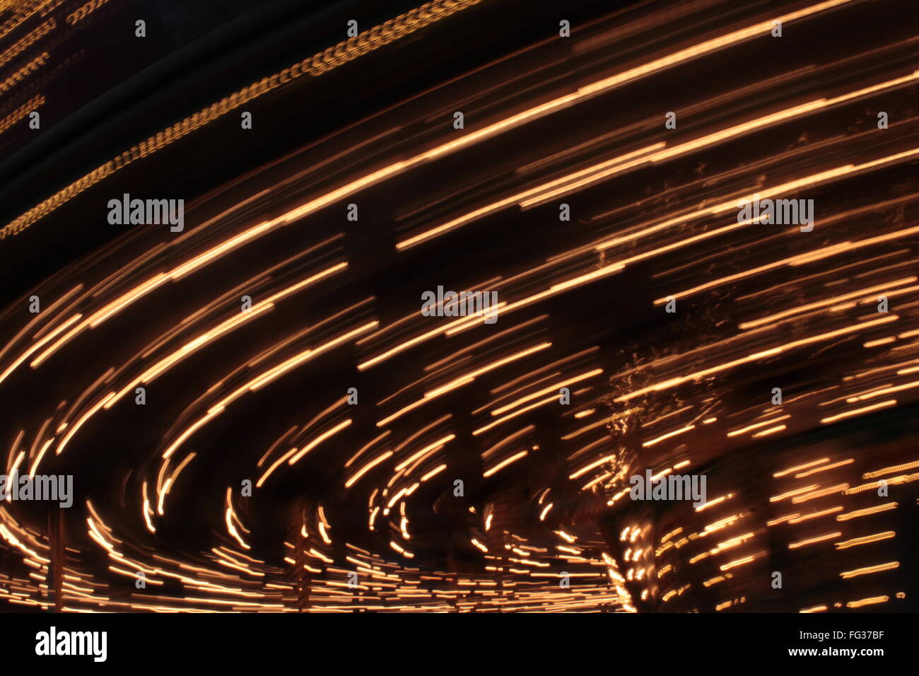 fairground funfair ride moving fast fair lights Night colours of the ...