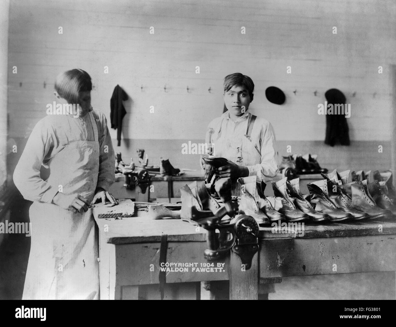 CARLISLE SCHOOL, c1904. /nYoung Native American working on shoes at the ...