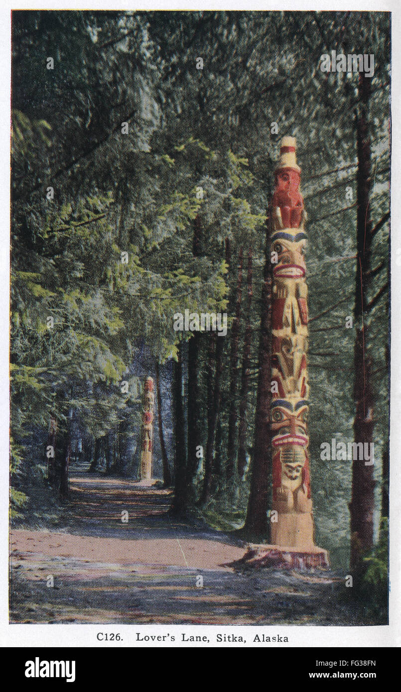 ALASKA: SITKA, c1930. /nPath lined with trees and totem poles, known as ...