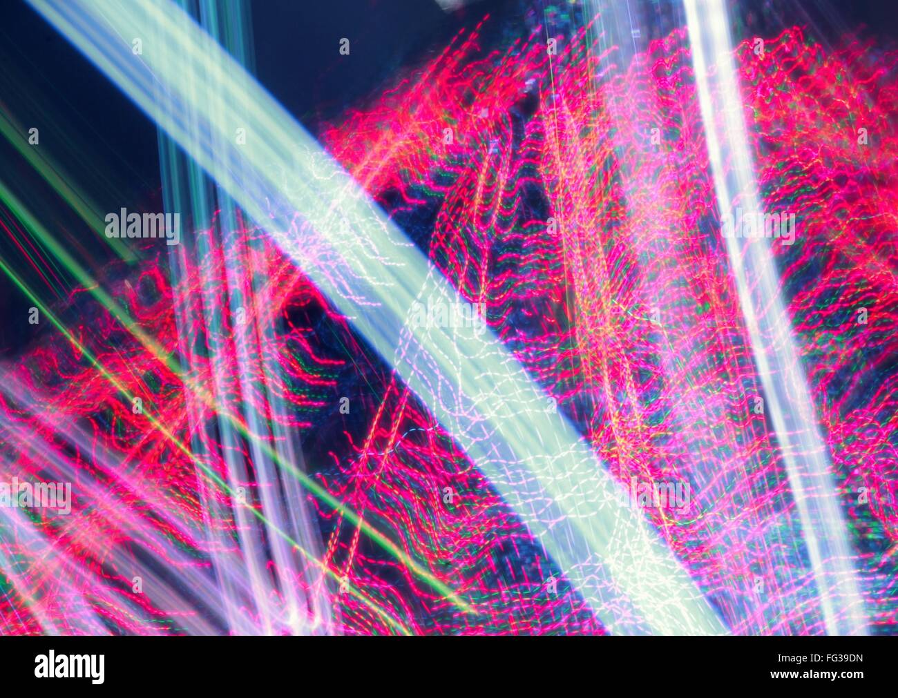 fairground funfair ride moving fast fair lights Night colours of the ...