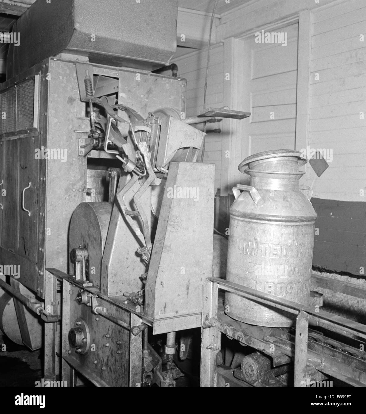VERMONT: CREAMERY, 1941. /nMilk cans on a conveyor belt leaving the ...