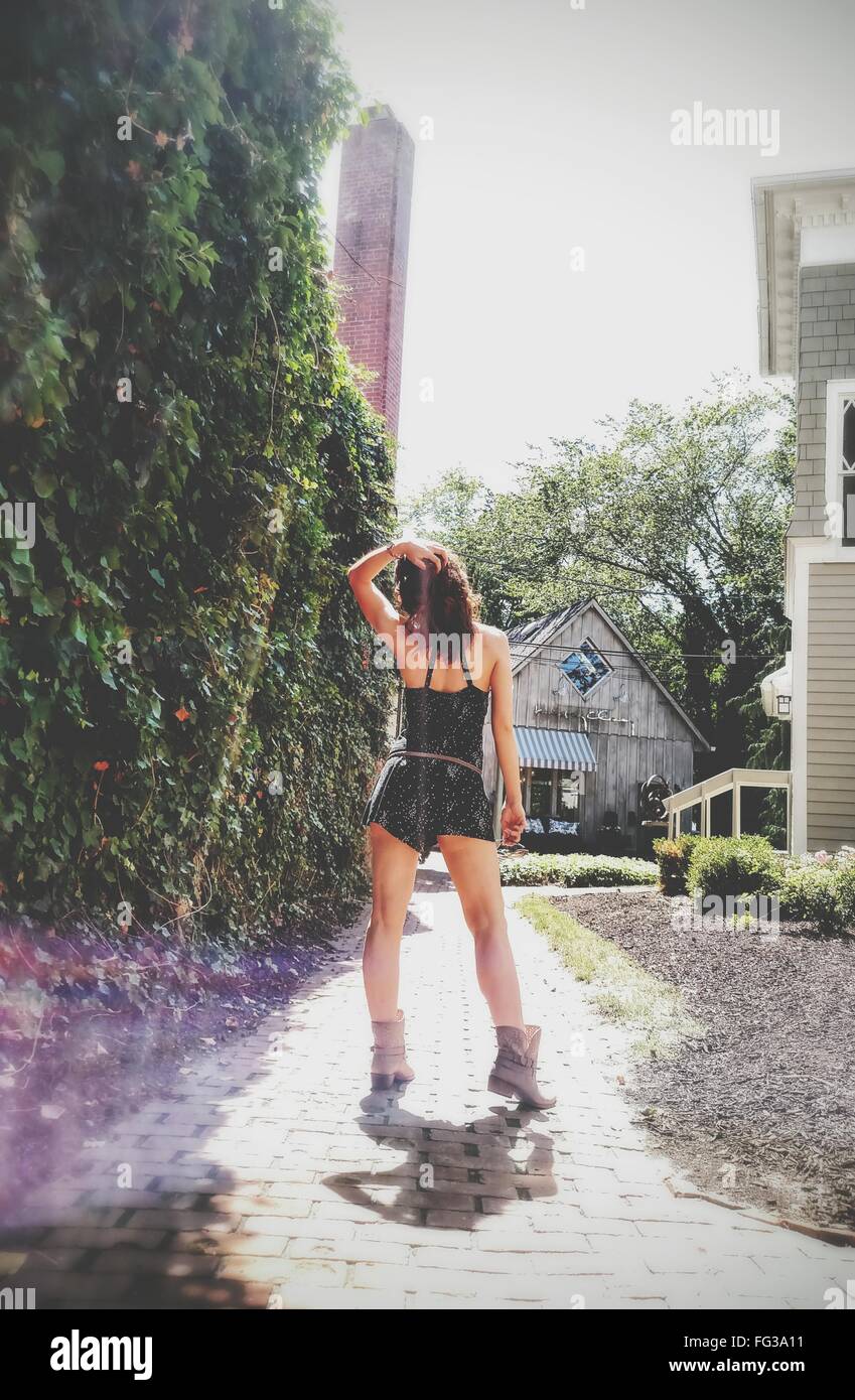 Attractive Woman Standing In Sunlight Stock Photo - Alamy