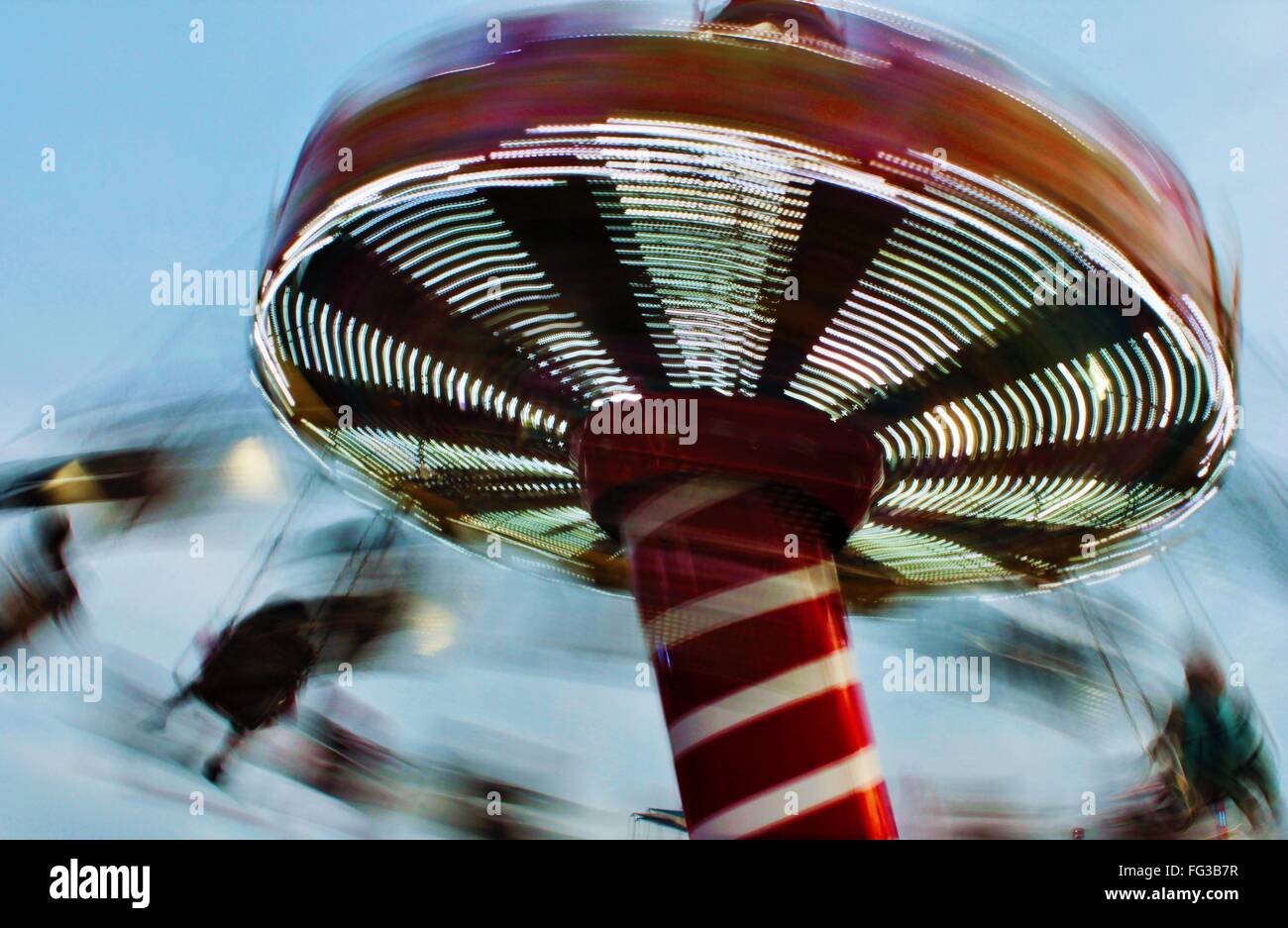 fairground funfair ride moving fast fair lights Night colours of the ...