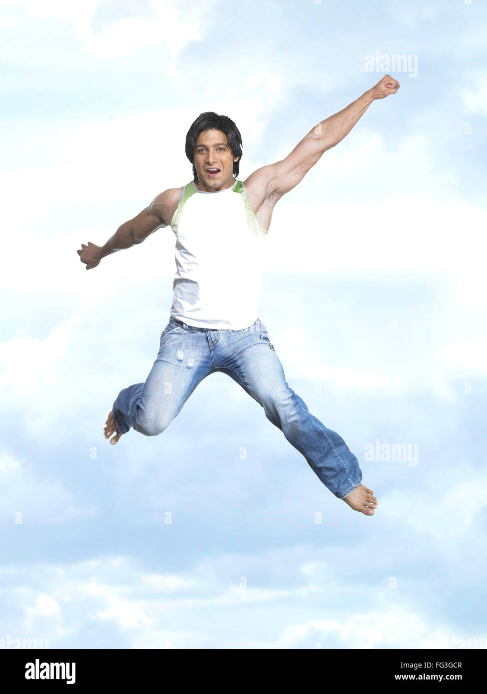 Man jumping with joy in blue sky MR# Stock Photo - Alamy