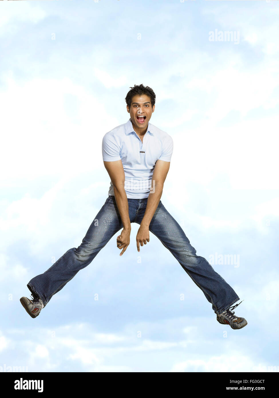 Man jumping with joy in blue sky MR Stock Photo - Alamy