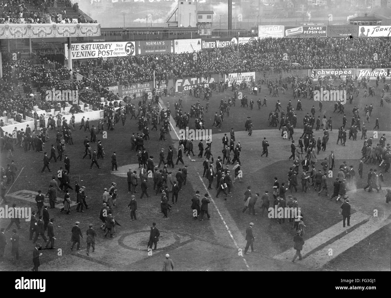 WORLD SERIES, 1913. /nFans on the field after the third game between ...