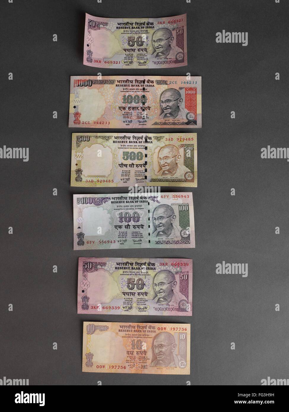 Indian currency notes on gray background Stock Photo - Alamy