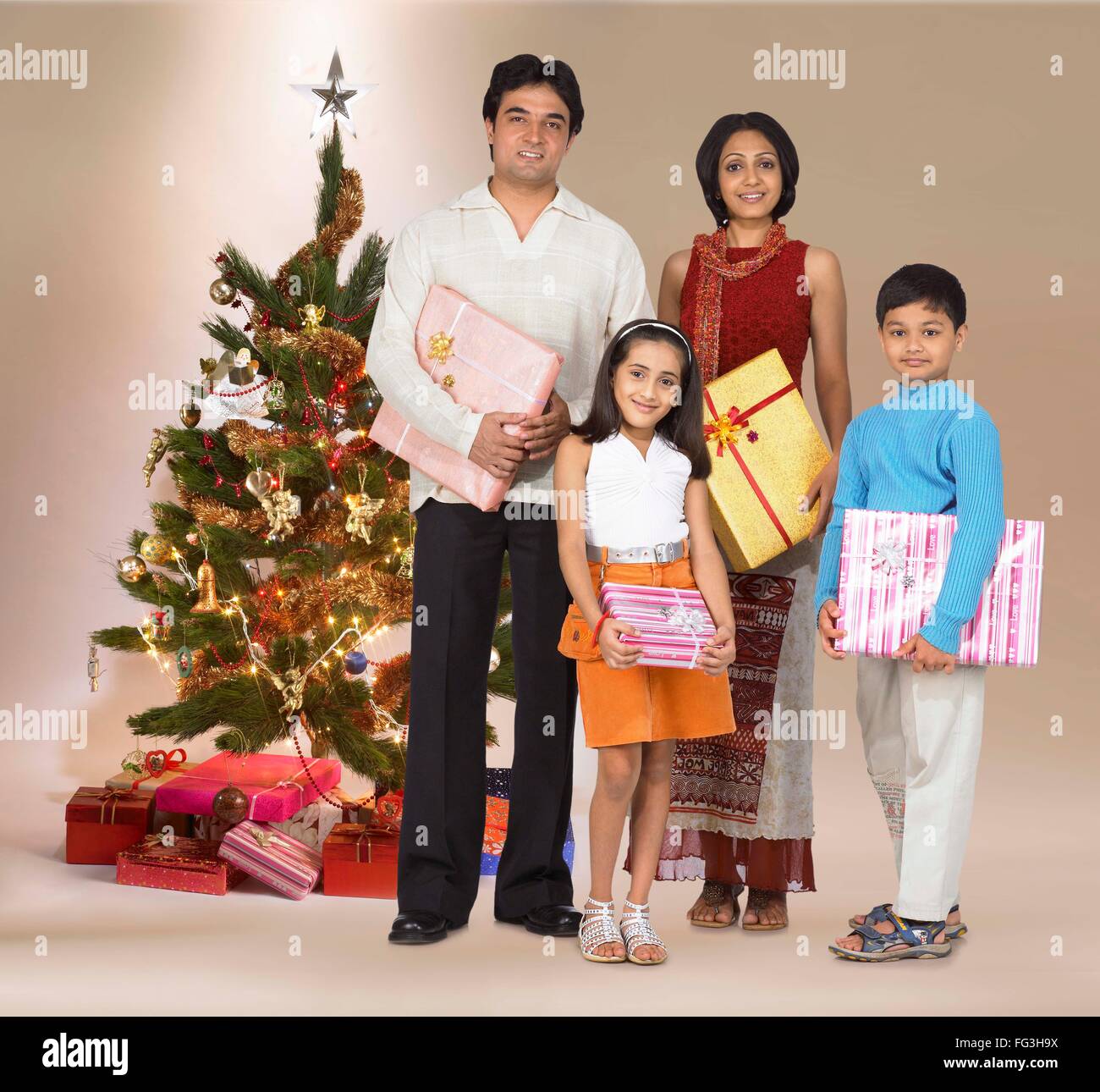 Parents and children celebrating Christmas festival MR Stock Photo - Alamy