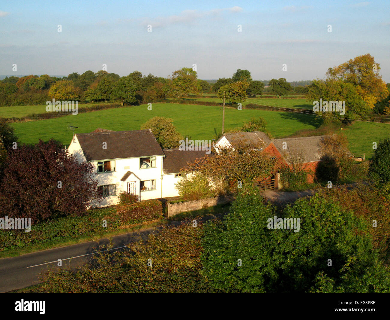 Rural white cottage with views to fields Stock Photo - Alamy