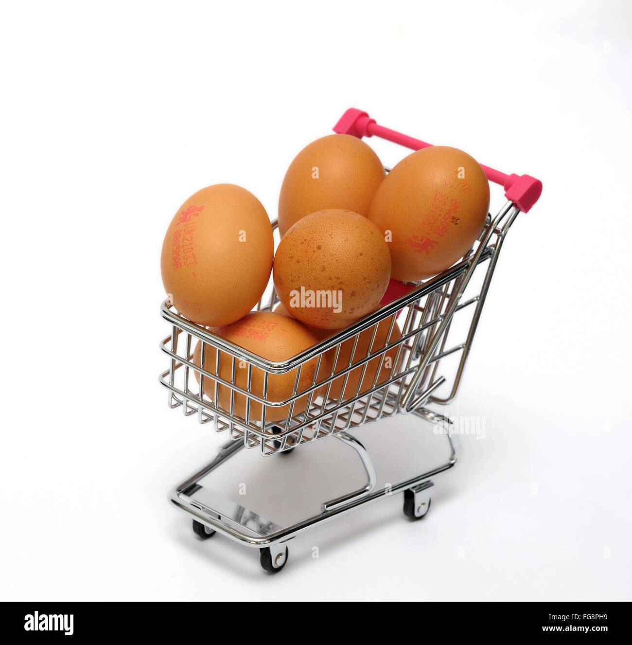 A miniature supermarket shopping trolley full of brown eggs Stock Photo ...