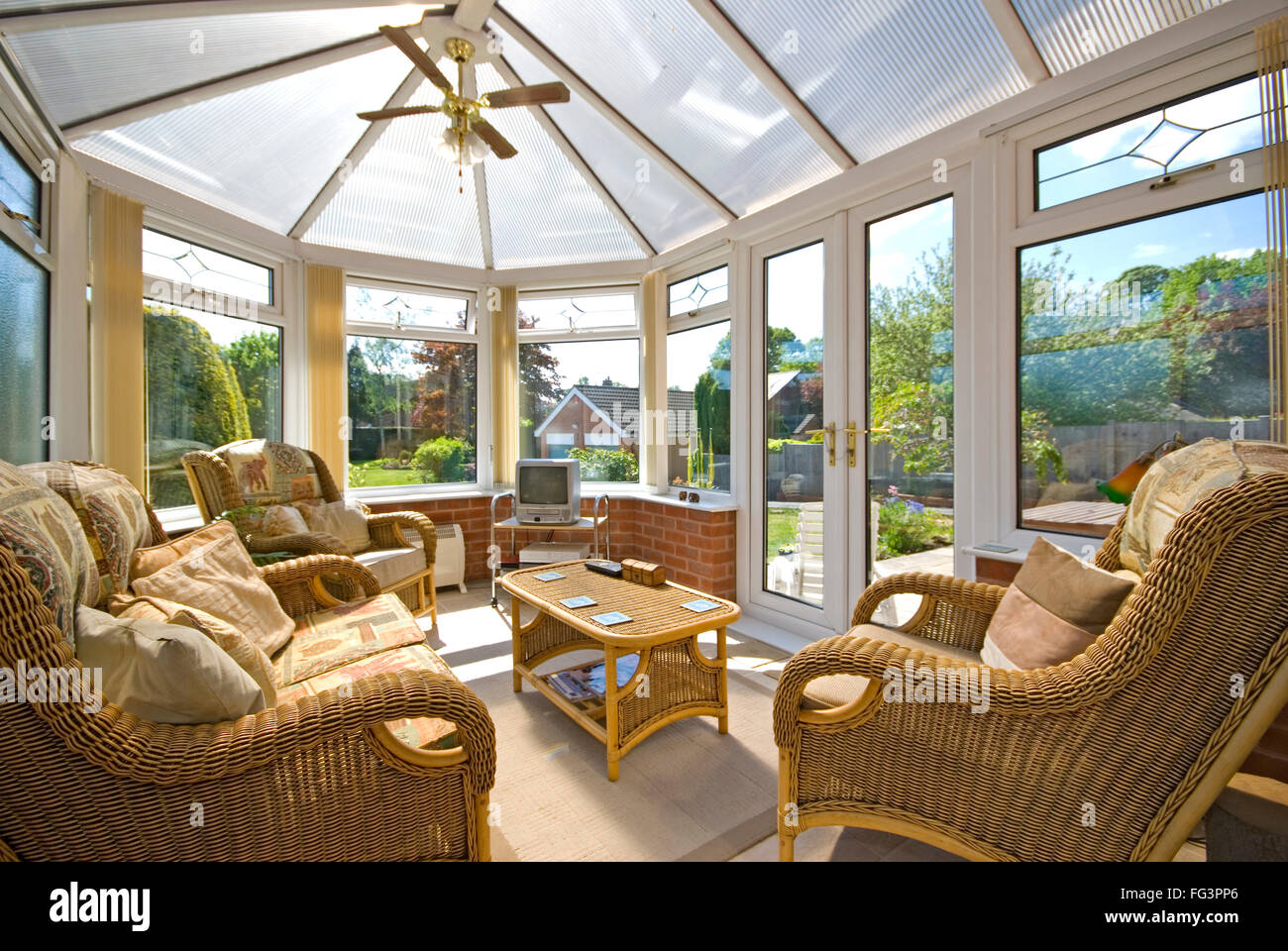 large conservatory showing garden beyond Stock Photo - Alamy