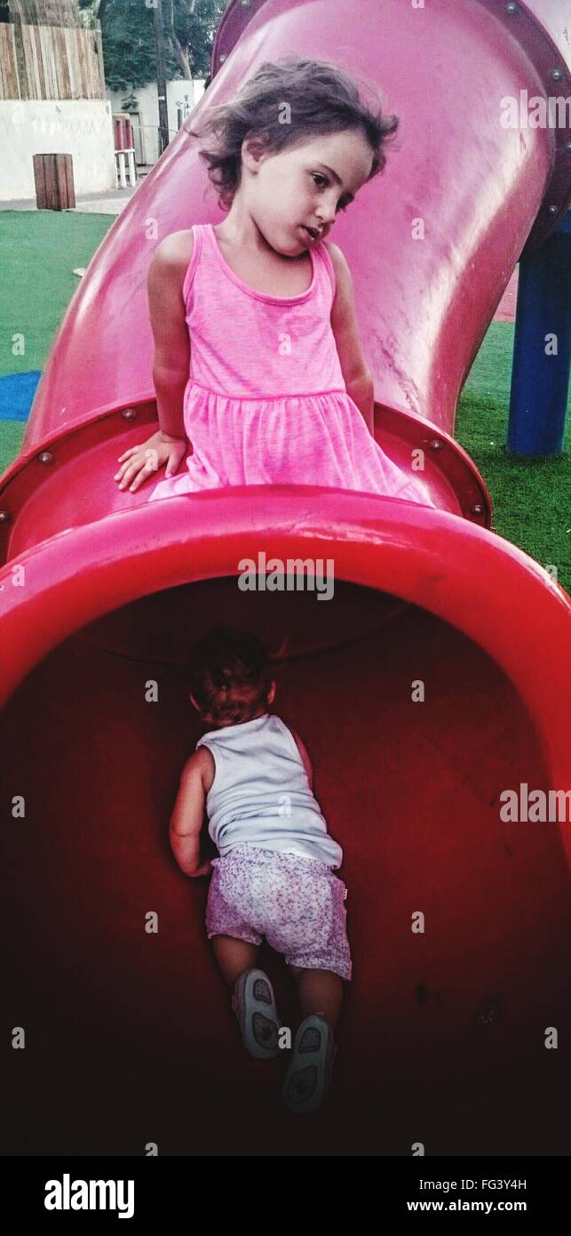 Children playing on slide hi-res stock photography and images - Alamy
