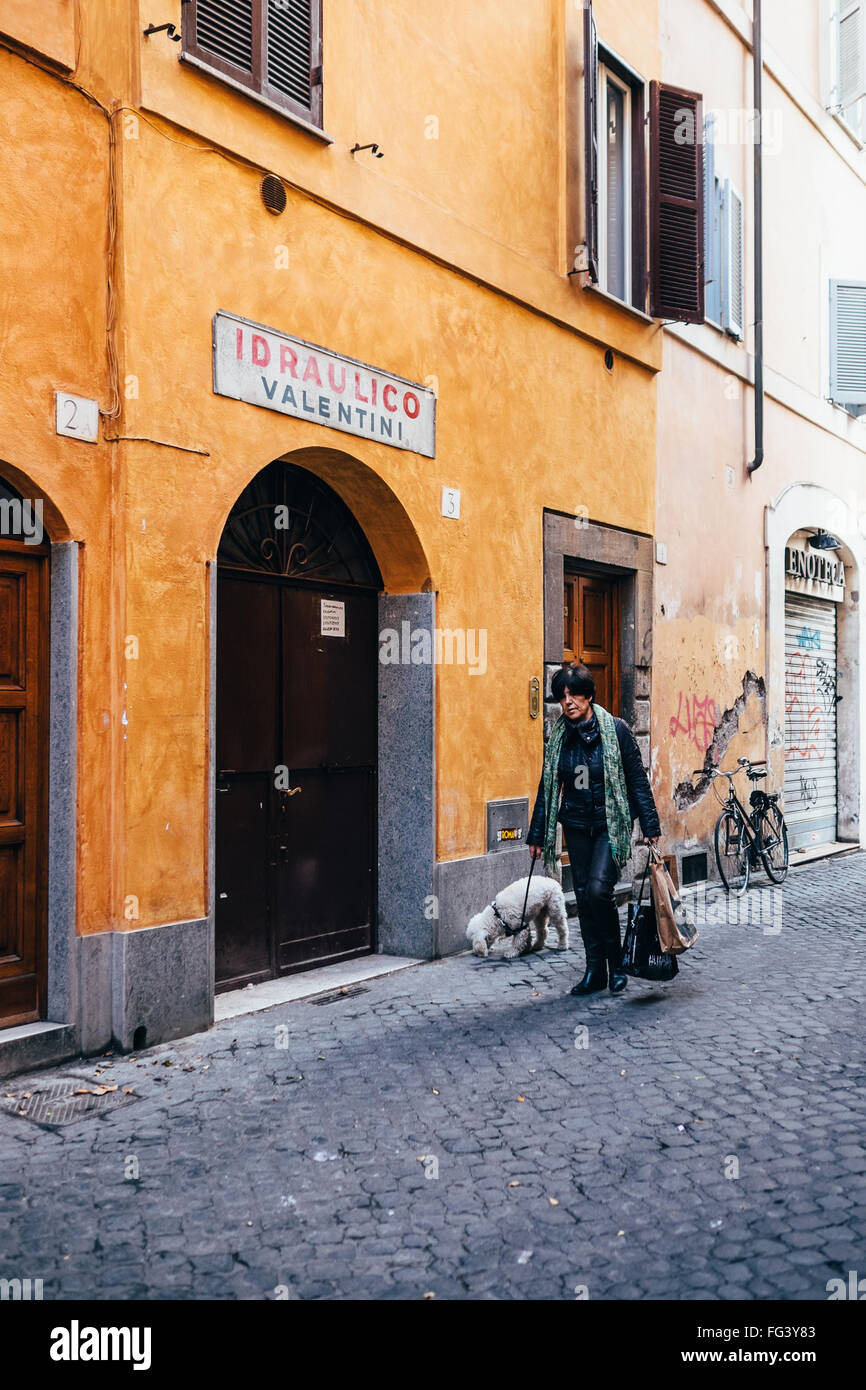 Person walking dog in street in rome hi-res stock photography and ...
