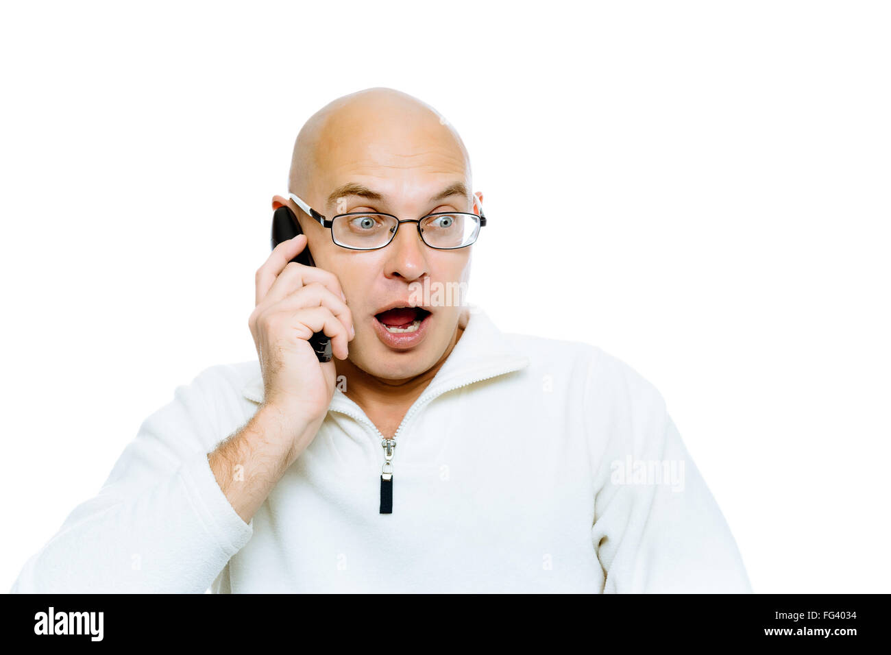 Bald man emotionally communicates by phone. Isolated on white. Studio ...