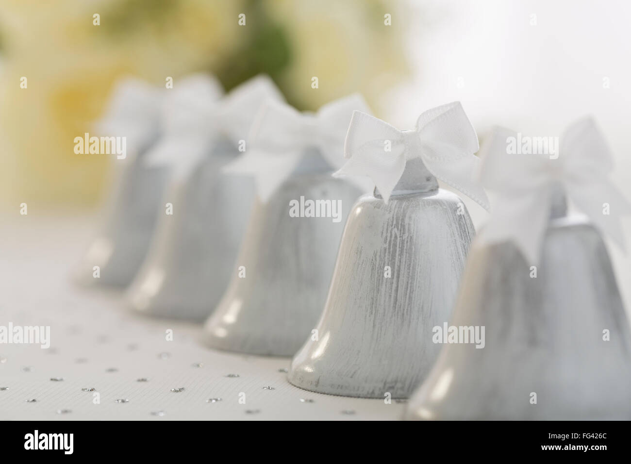 Decoration bells in row on table Stock Photo - Alamy