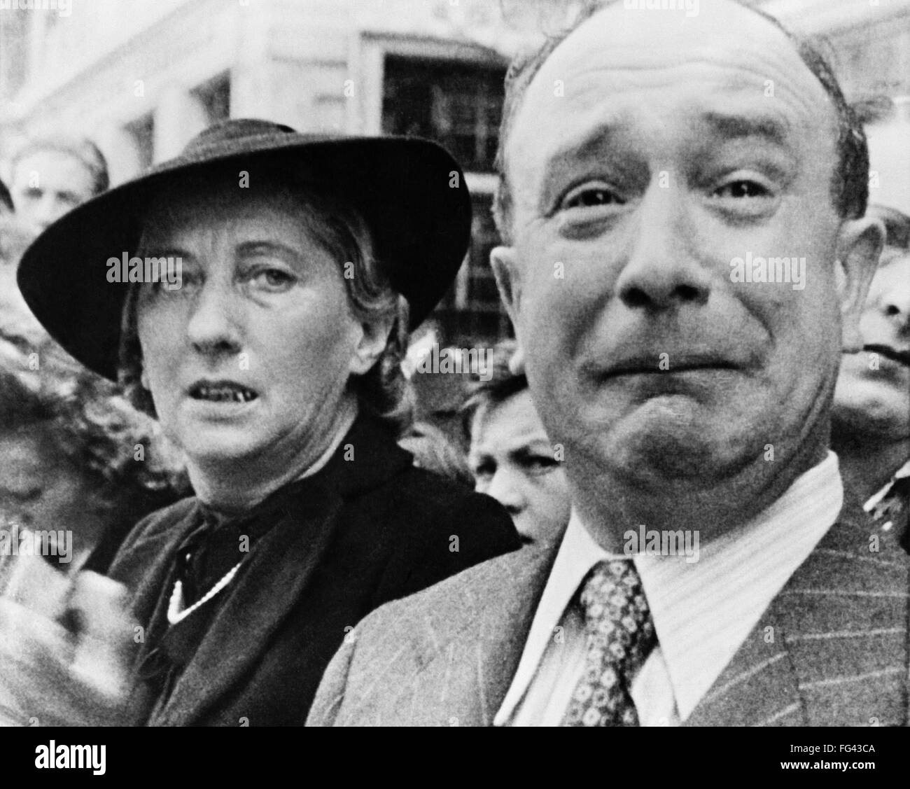 WWII: FRANCE, 1941. /nA Frenchman weeping as the French regiment flags ...