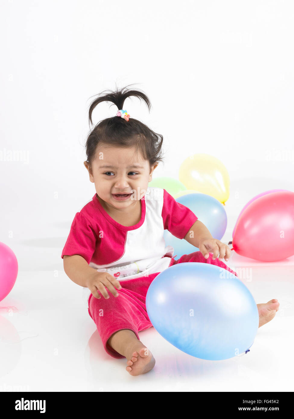 Indian baby crying MR#702O Stock Photo - Alamy