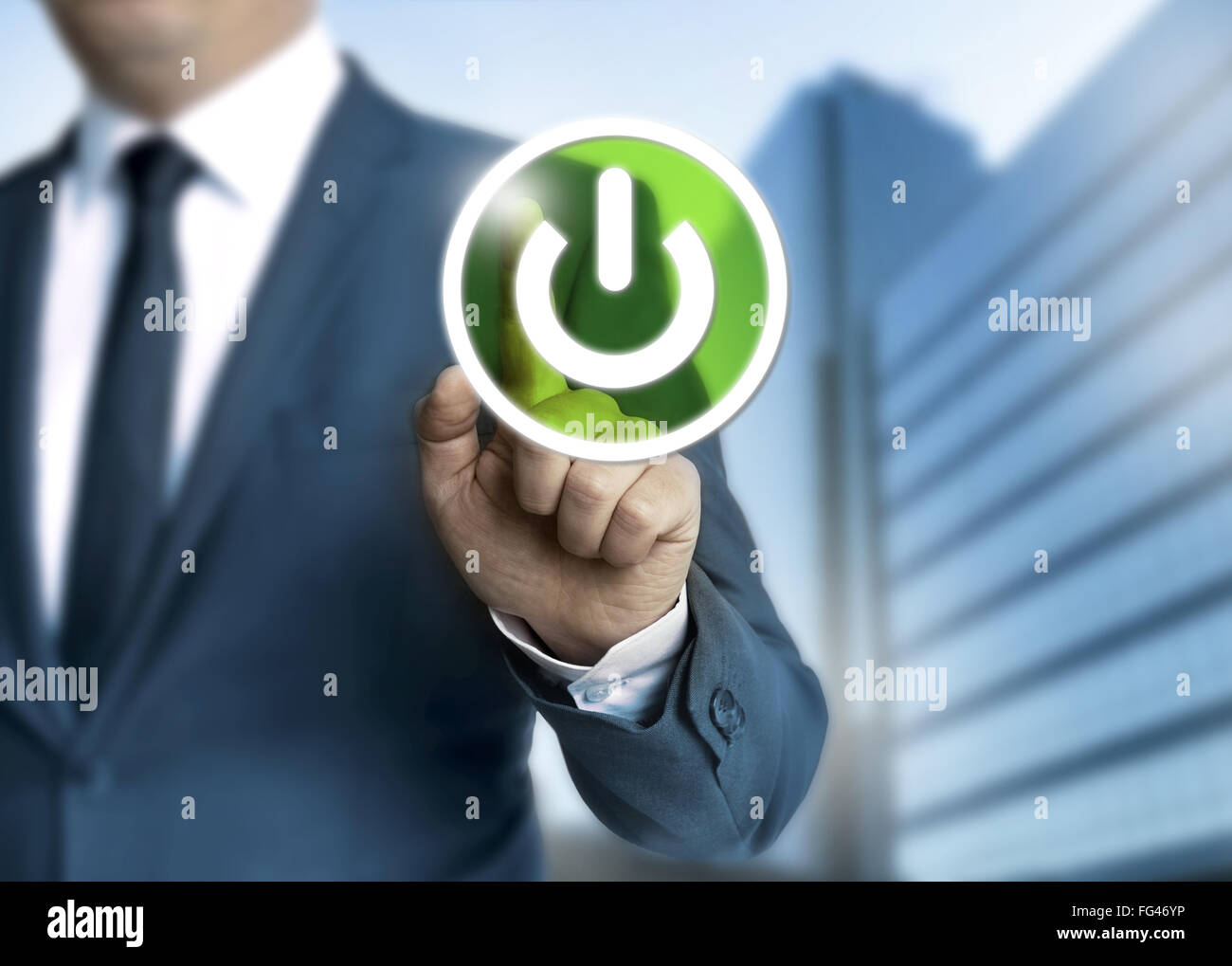 Man pushes power button concept background Stock Photo - Alamy