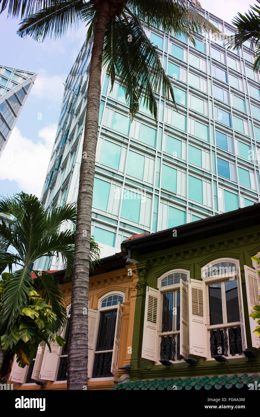 Traditional Chinese shop houses in front of modern office building in ...