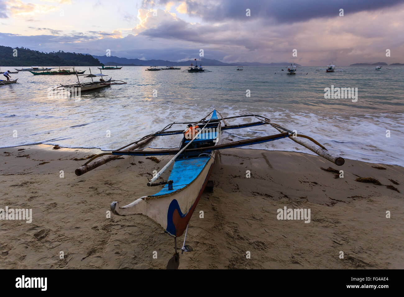 Outrigger boats shore beach sky beach hi-res stock photography and ...