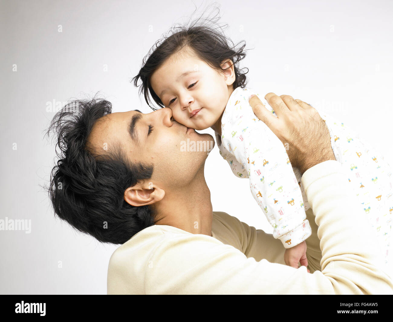 Indian father kissing on cheek hi-res stock photography and images - Alamy