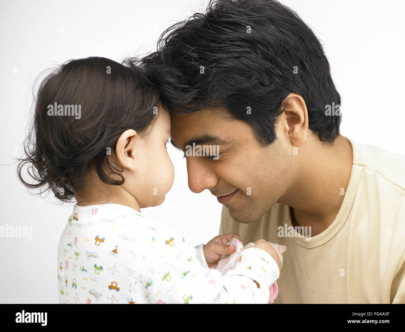 Indian Mother And Father With Baby