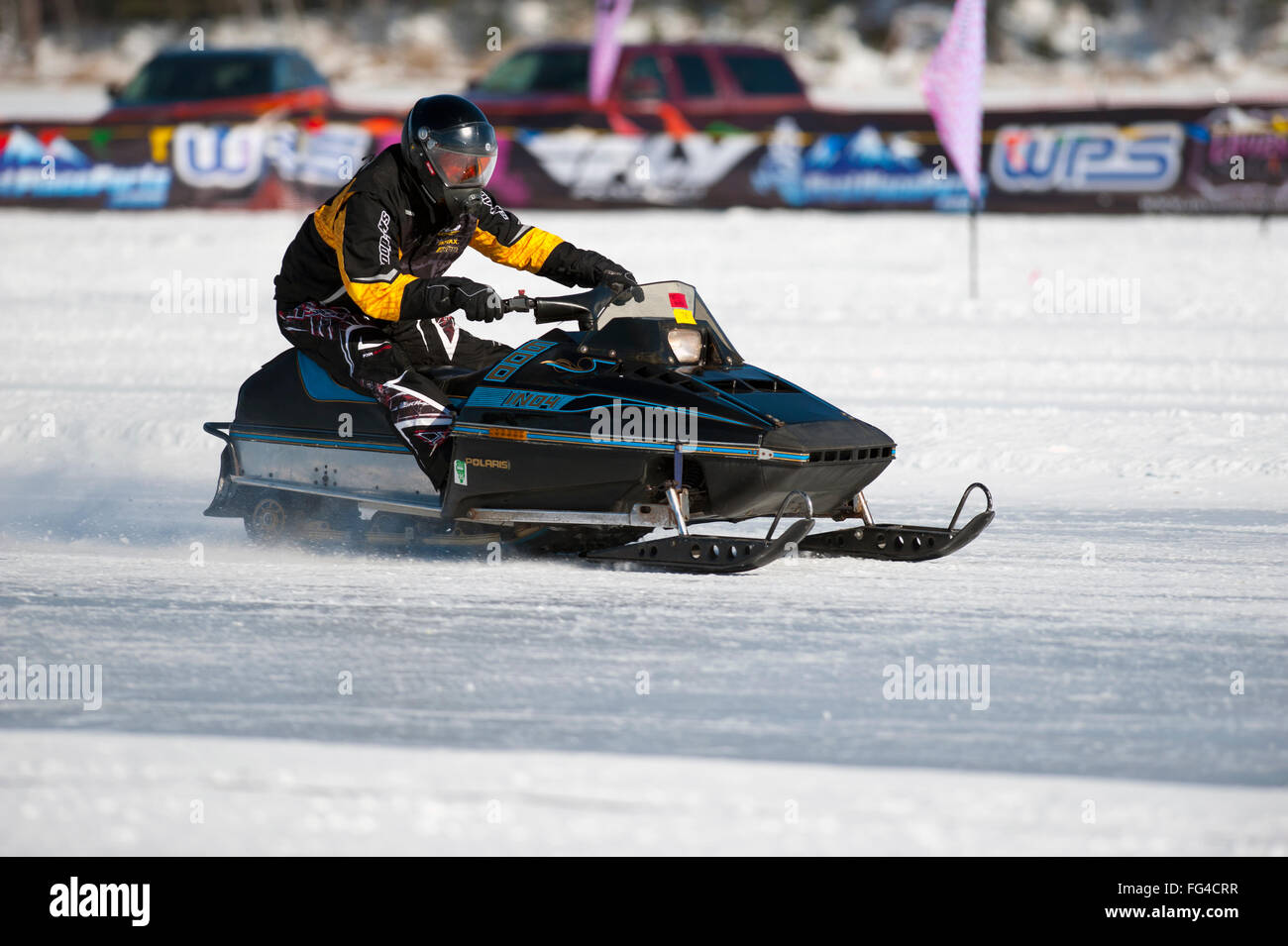 A snowmobiler races his sled against the radar that records his top ...