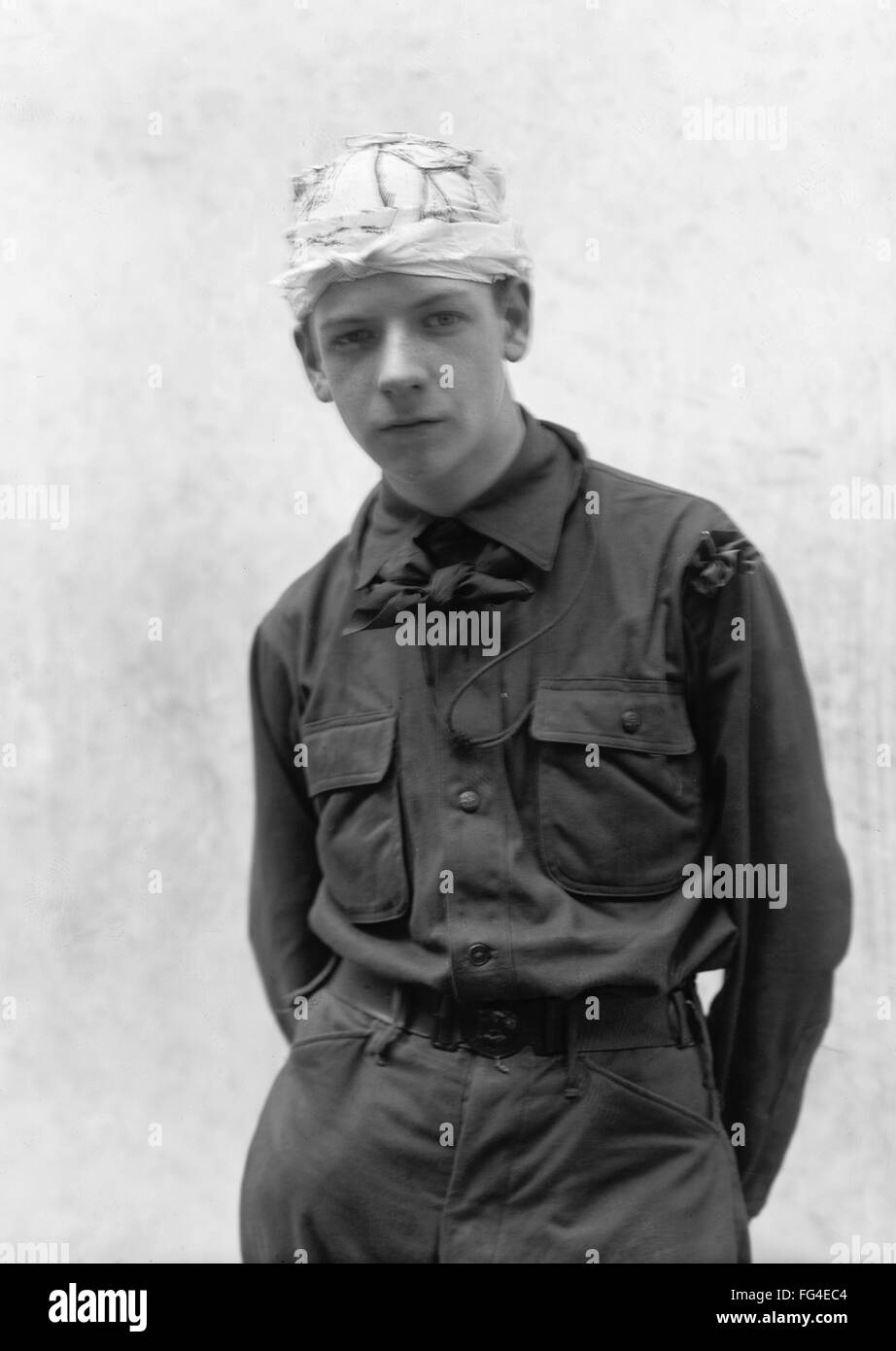 BOY SCOUTS, 1912. /nA Boy Scout demonstrating first aid bandage ...