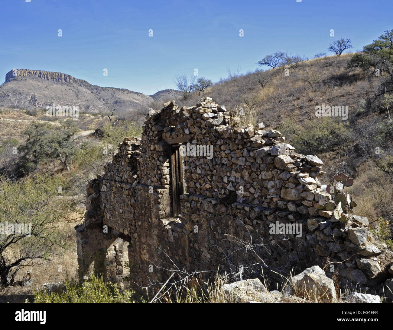 Remains of the Old Glory Mine MIll ghost town.The background shows ...