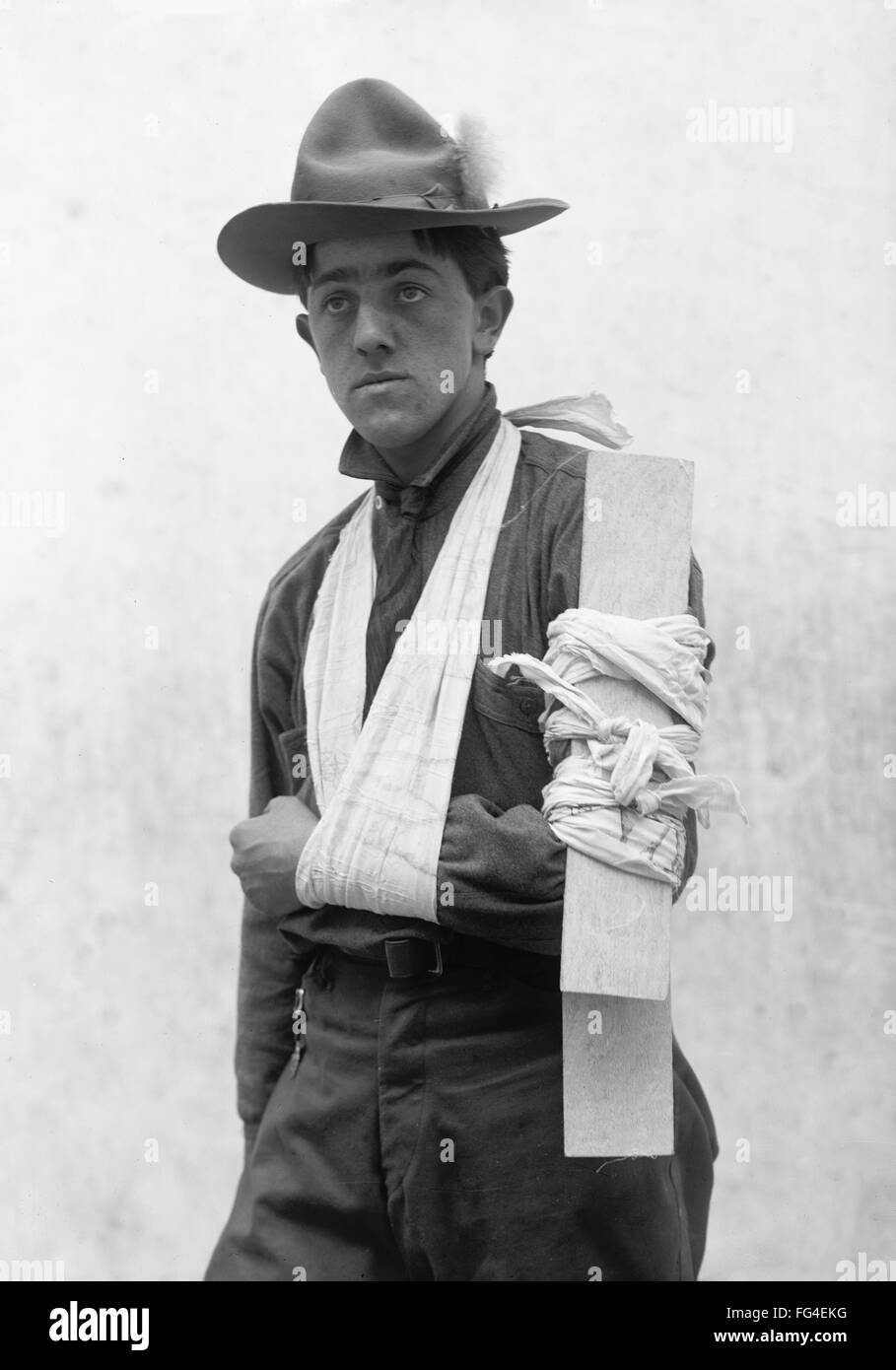 BOY SCOUTS, 1912. /nA Boy Scout demonstrating first aid splint ...