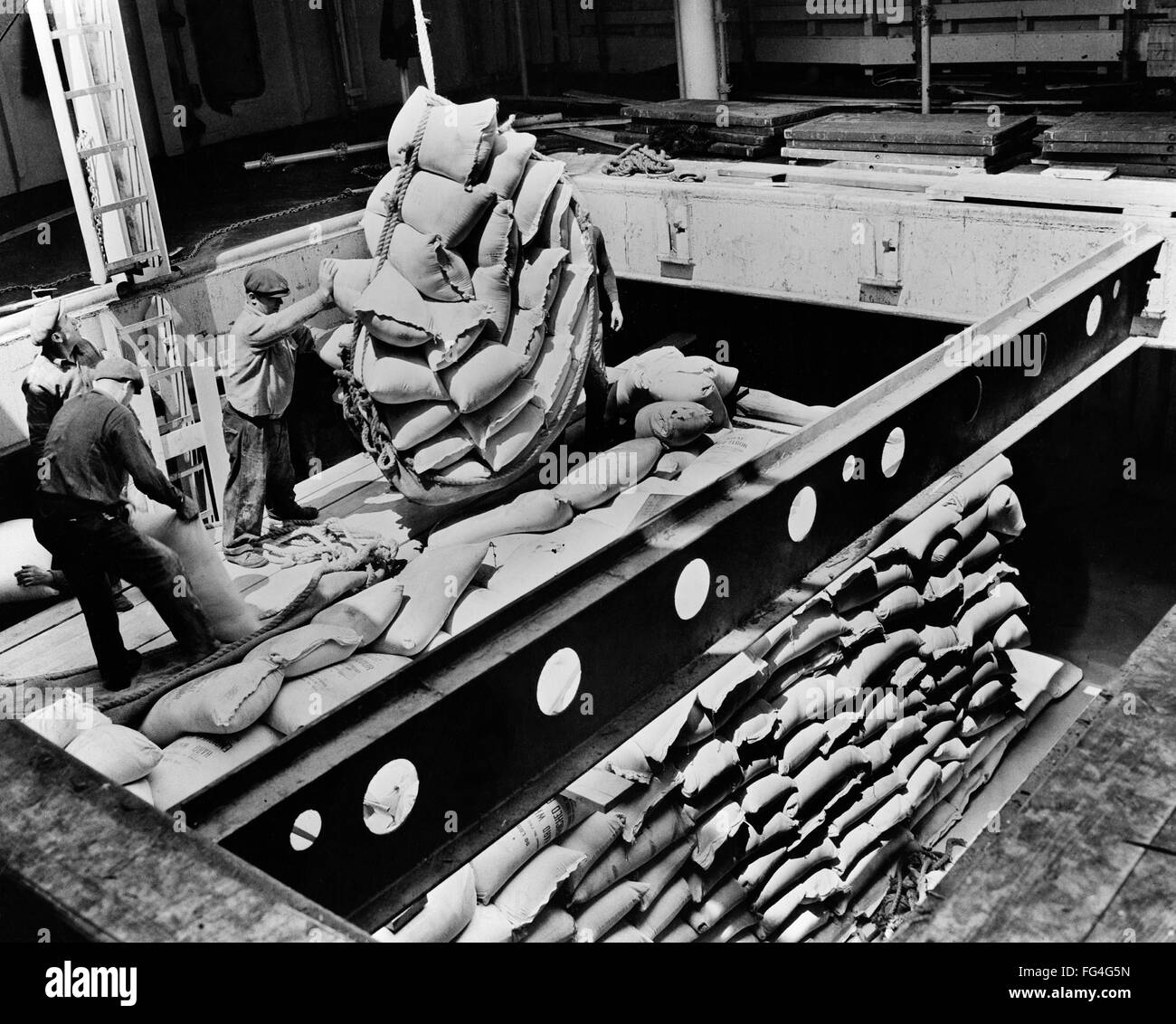 WWII: WAR RELIEF, c1943. /nWorkers loading bags of flour onto an ...