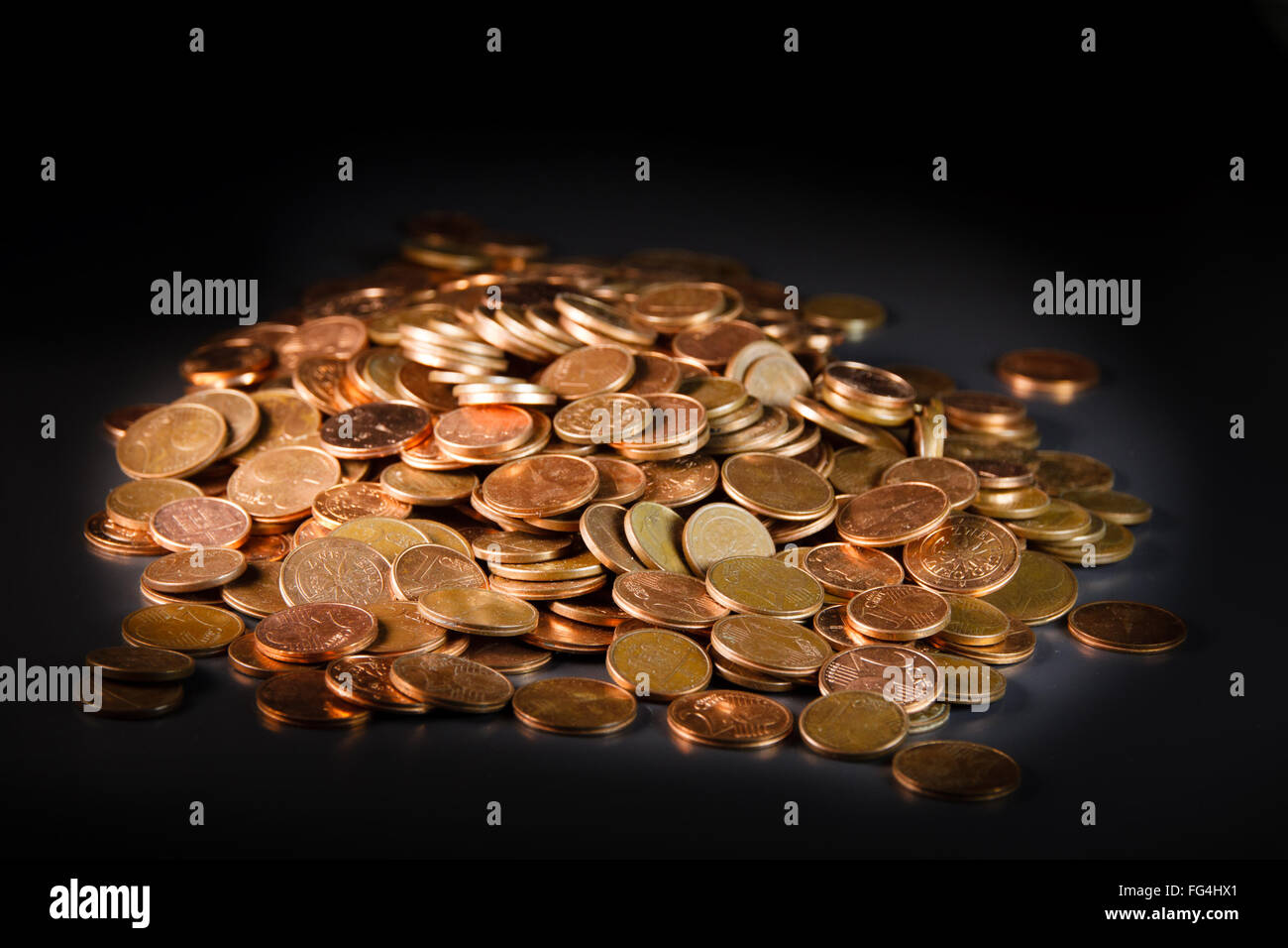 Pile of copper European currencies on a black background Stock Photo ...