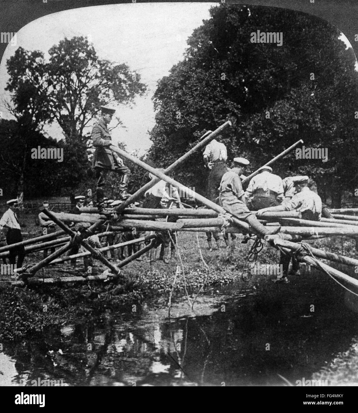 WORLD WAR I: BRIDGE. /nTroops building a temporary bridge for the ...