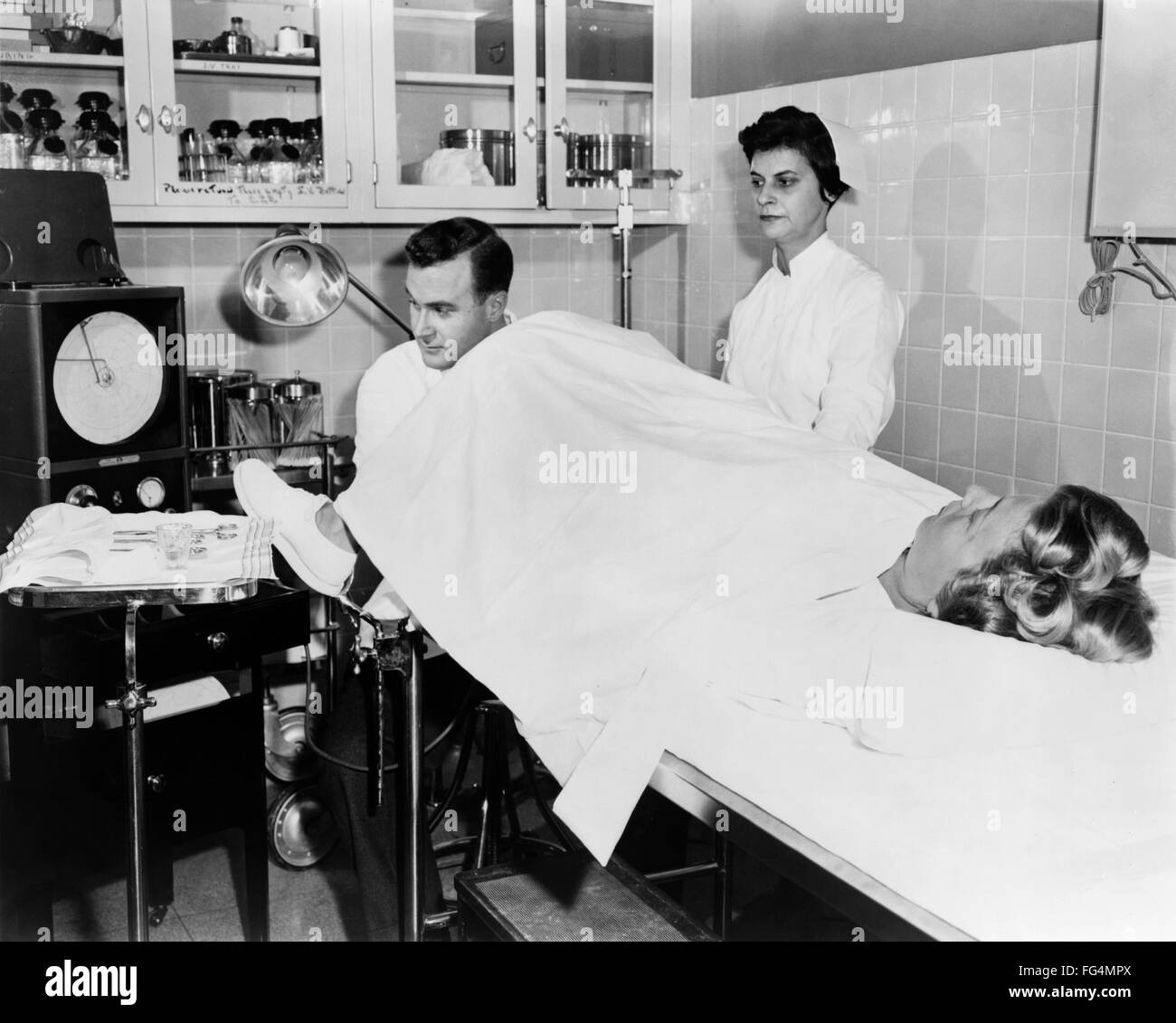 INFERTILITY CLINIC, 1956. /nDr. Marvin Hans performing a tubal ...
