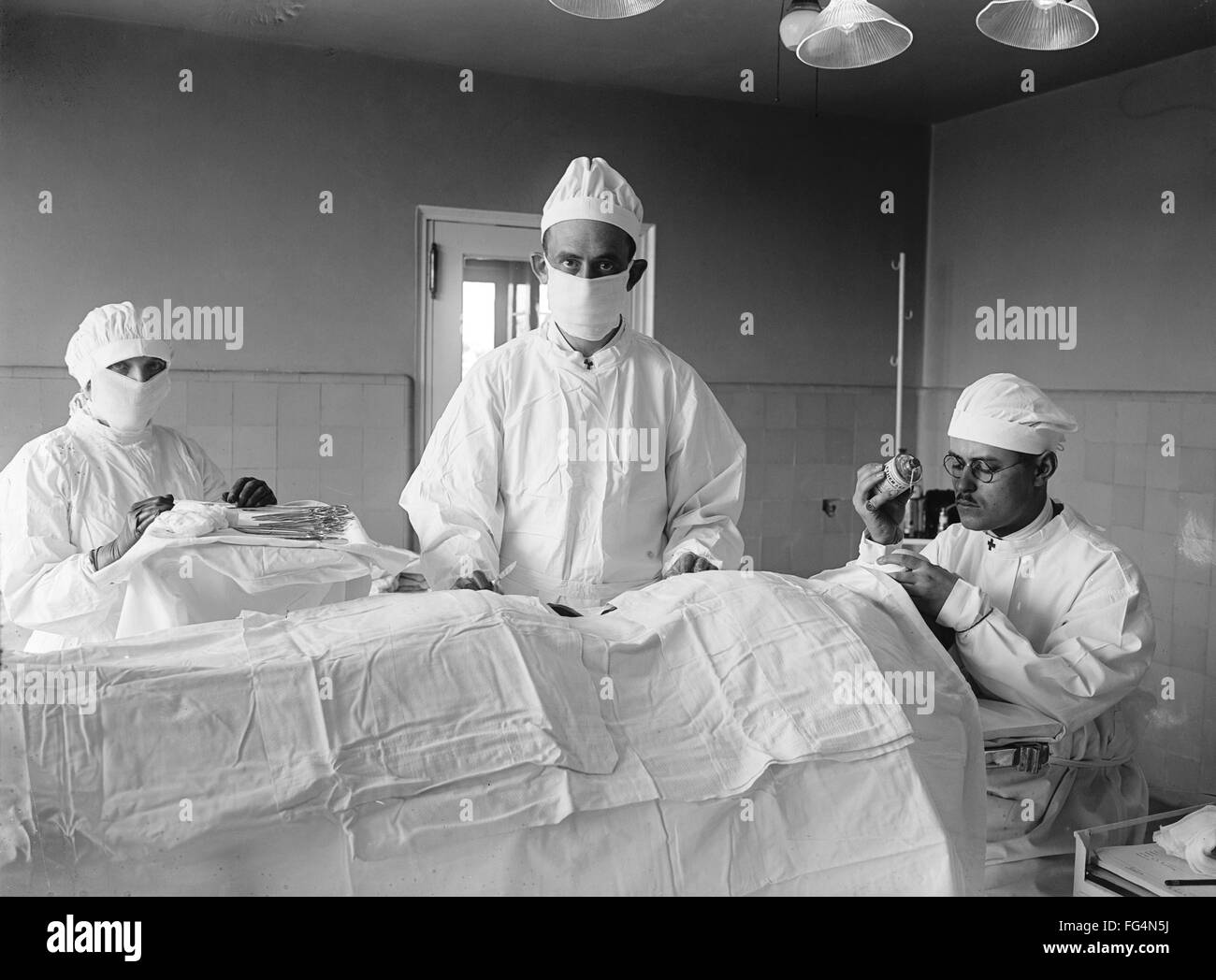 SURGERY, 1922. /nSurgeons at work in an operating room. Photograph ...