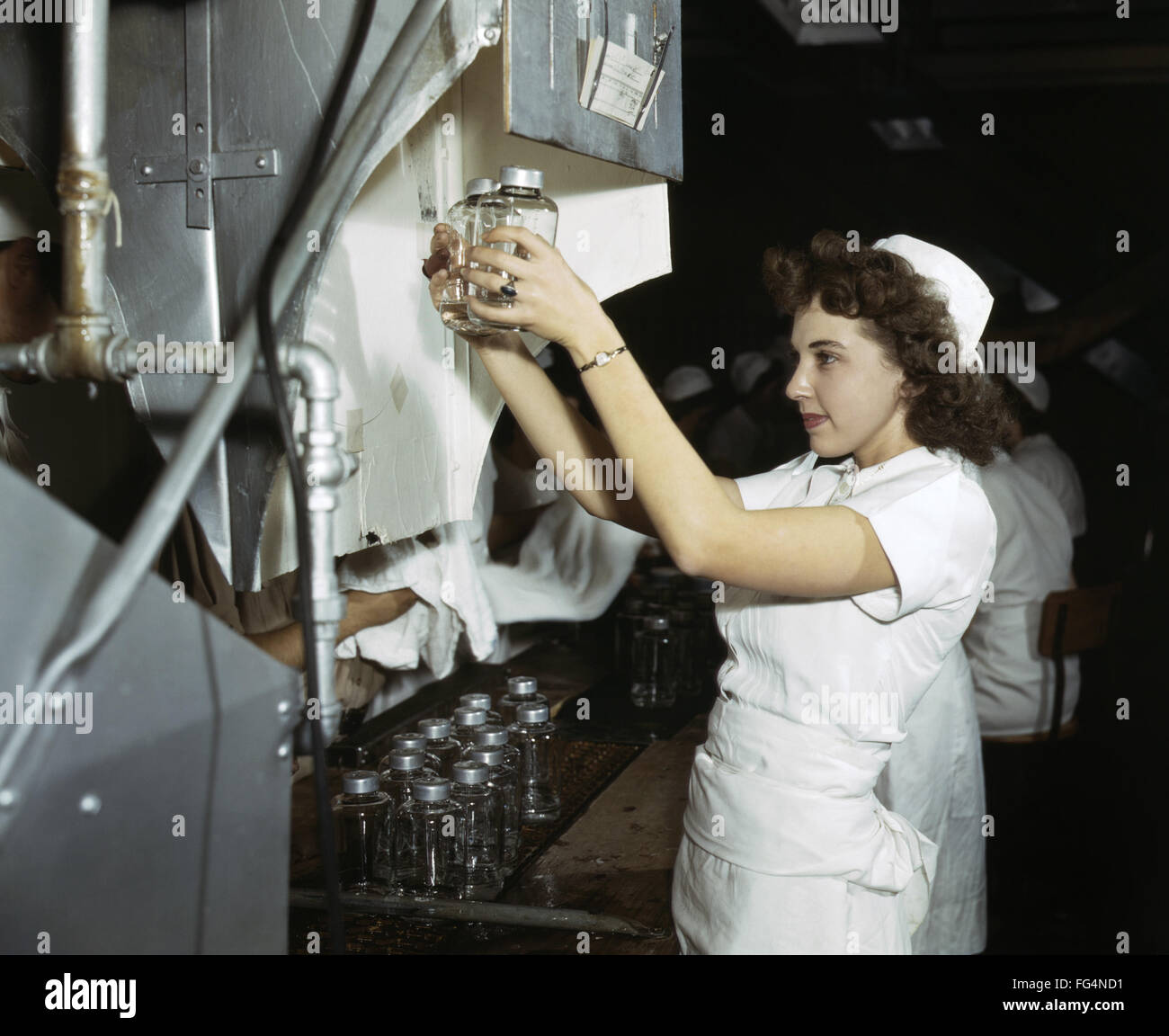 WWII: WORKERS, 1942. /nA worker with blood transfusion bottles at ...