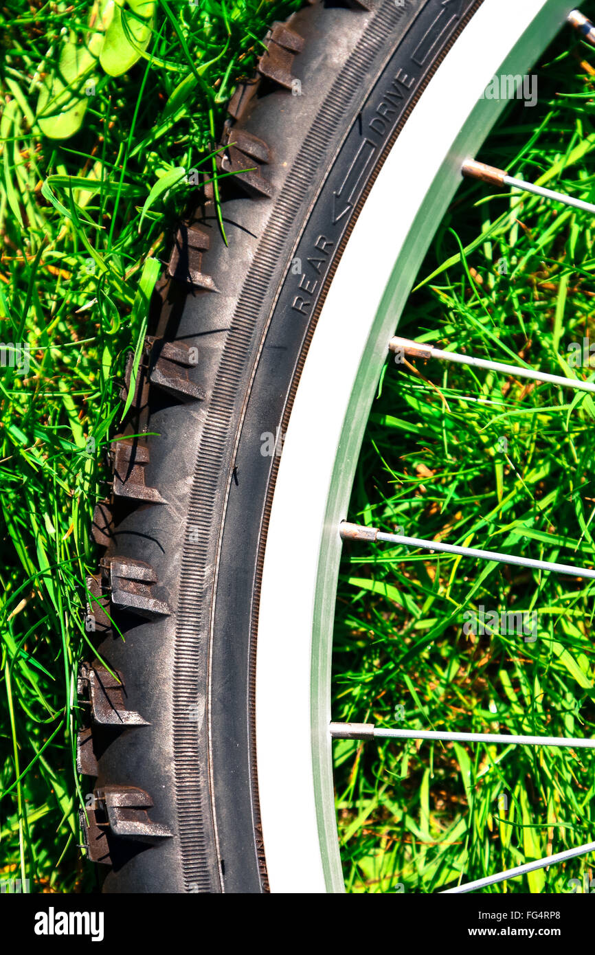 Mountain bike wheel and tyre laid on a grass lawn Stock Photo - Alamy