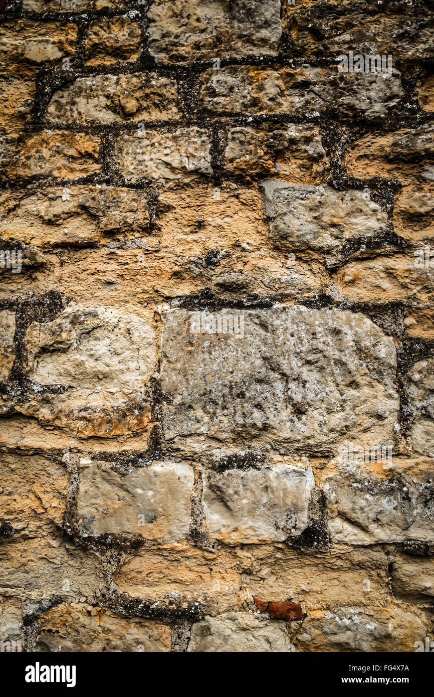 An old, weathered, aged, Stone, brick, rock wall with texture and ...