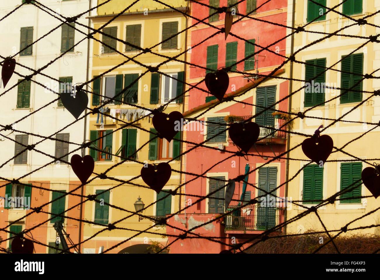 Heart Shapes On Net Against Buildings Stock Photo - Alamy