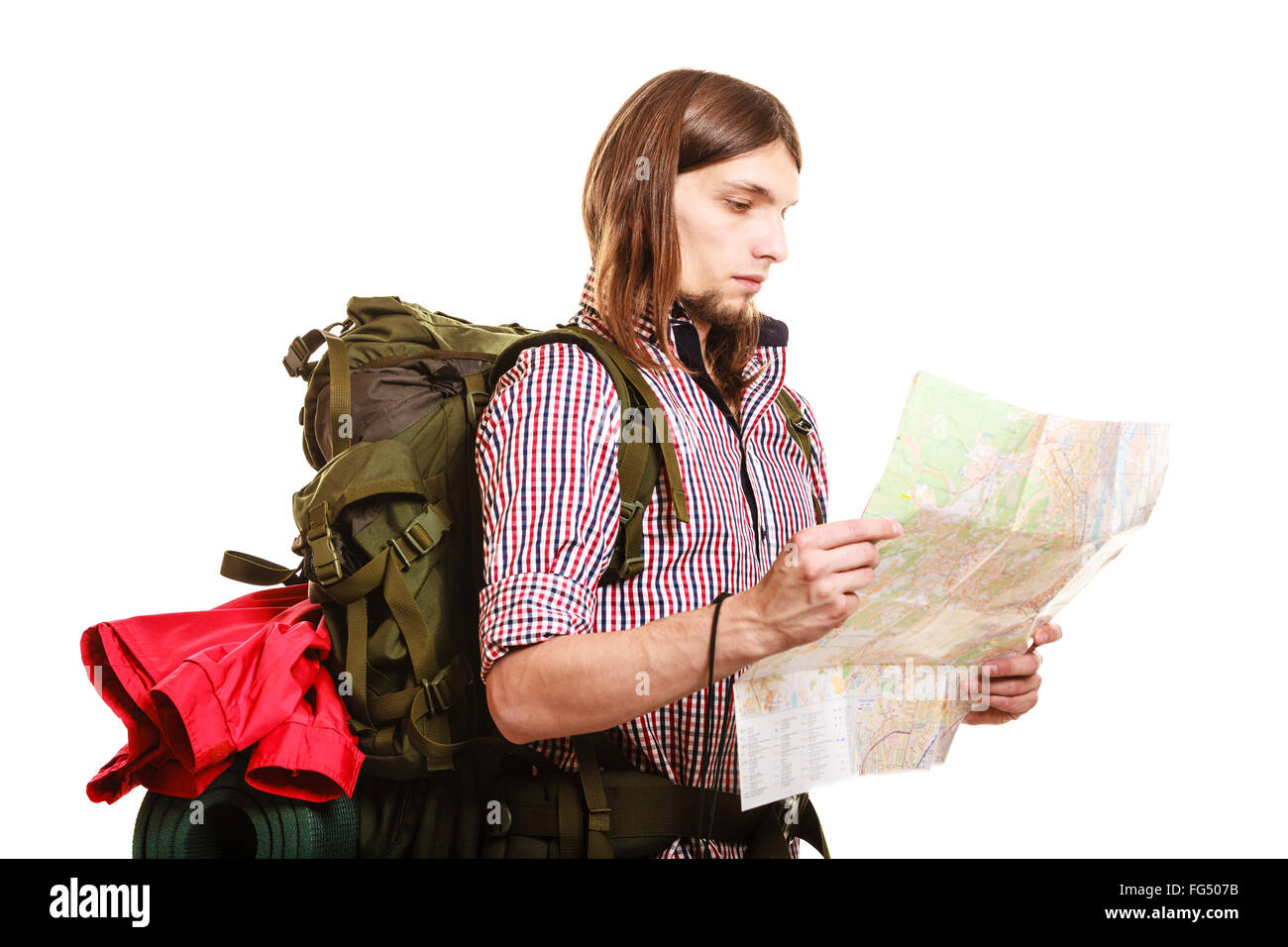 Man tourist backpacker reading map on trip. Young guy hiker searching ...