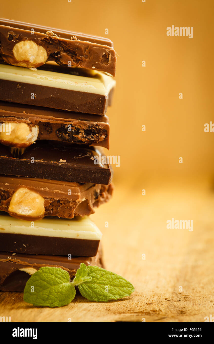 Closeup stack of different sorts chocolate pieces. Variety of ...