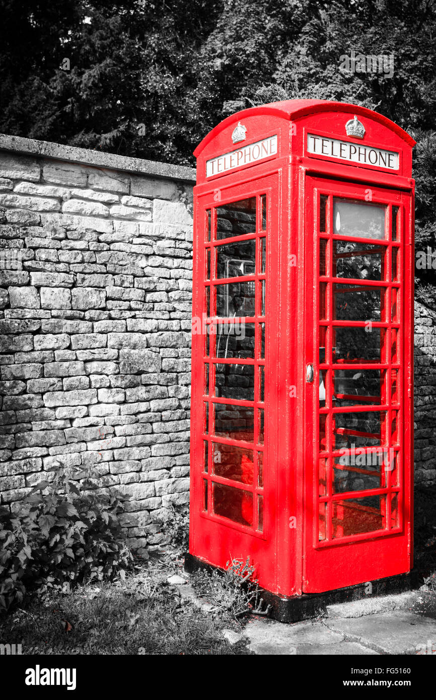 Traditional red telephone box booth or public payphone, village Bibury ...